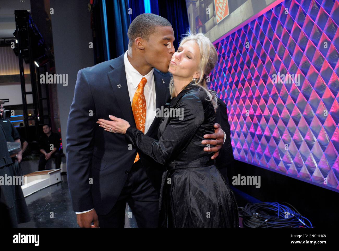 Auburn quarterback Cam Newton, left, is congratulated by Jonna Chizik ...