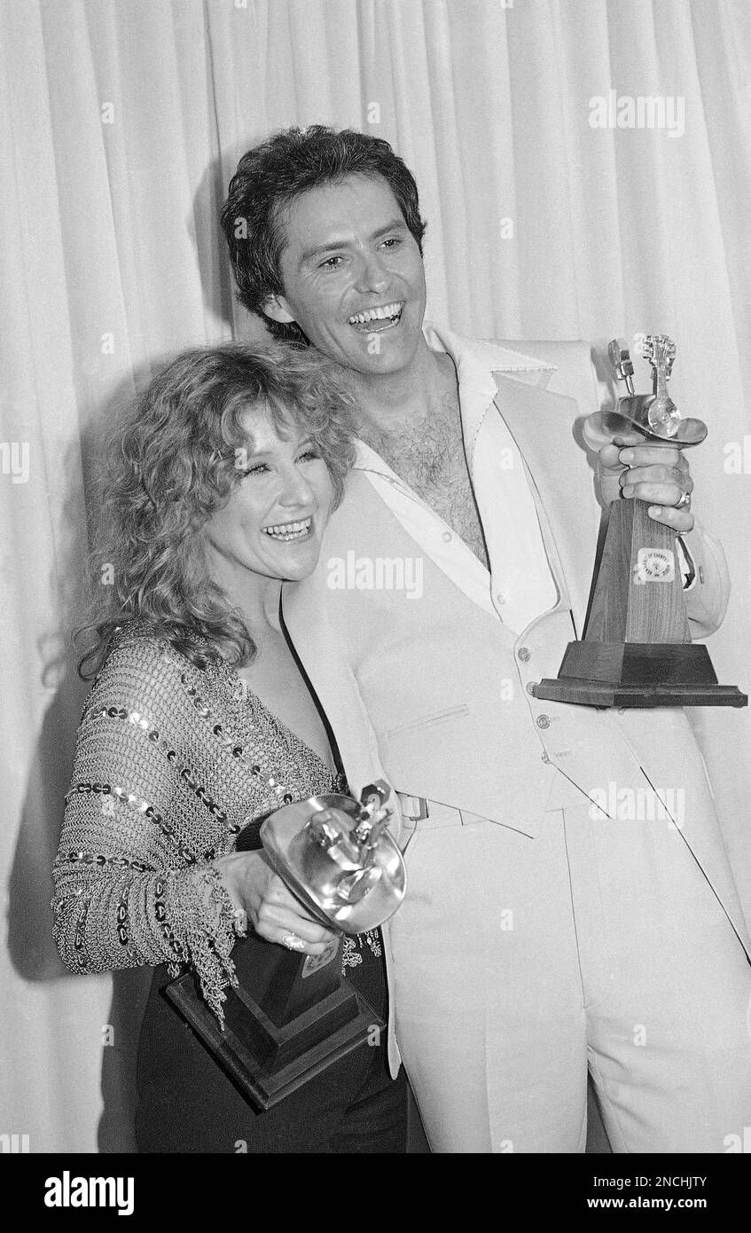 Standing smiling holding trophy achievement success fame hi-res stock ...