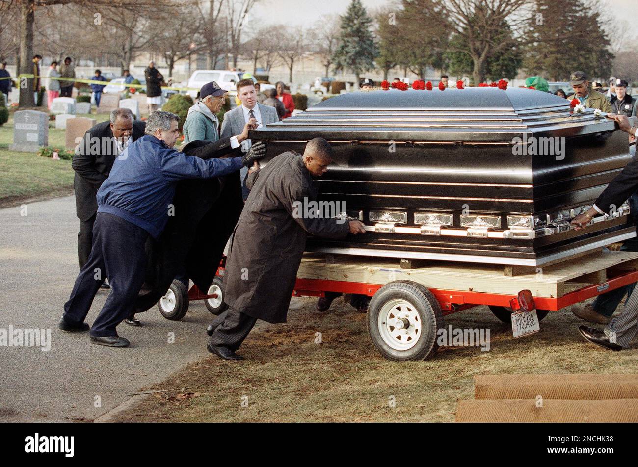 Eleven-hundred-pound man, Walter Hudson's coffin is pushed to its grave in Greenfield Cemetery ...