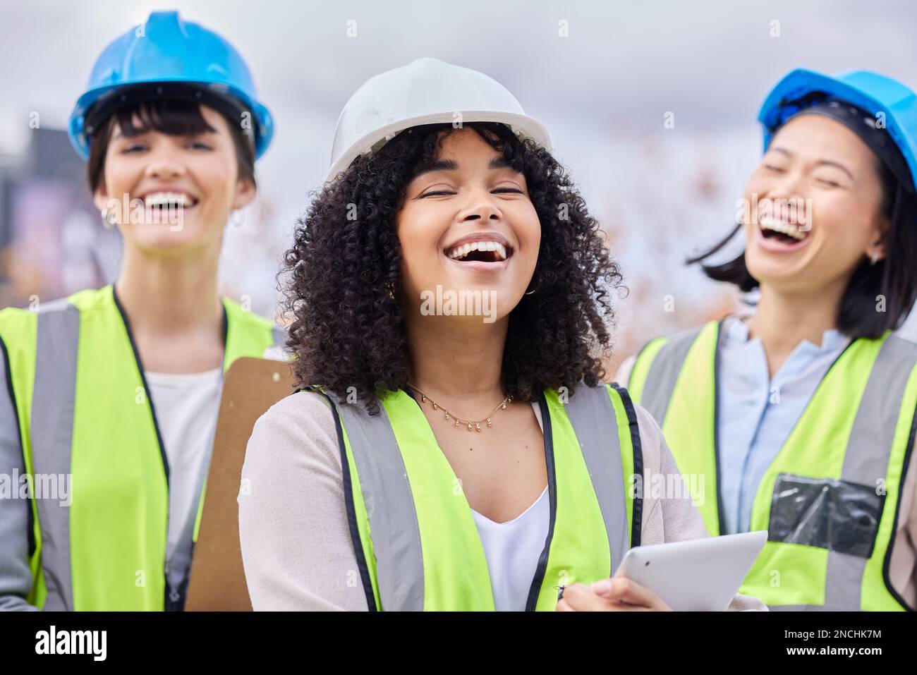 Construction, collaboration and friends laughing while working on a ...