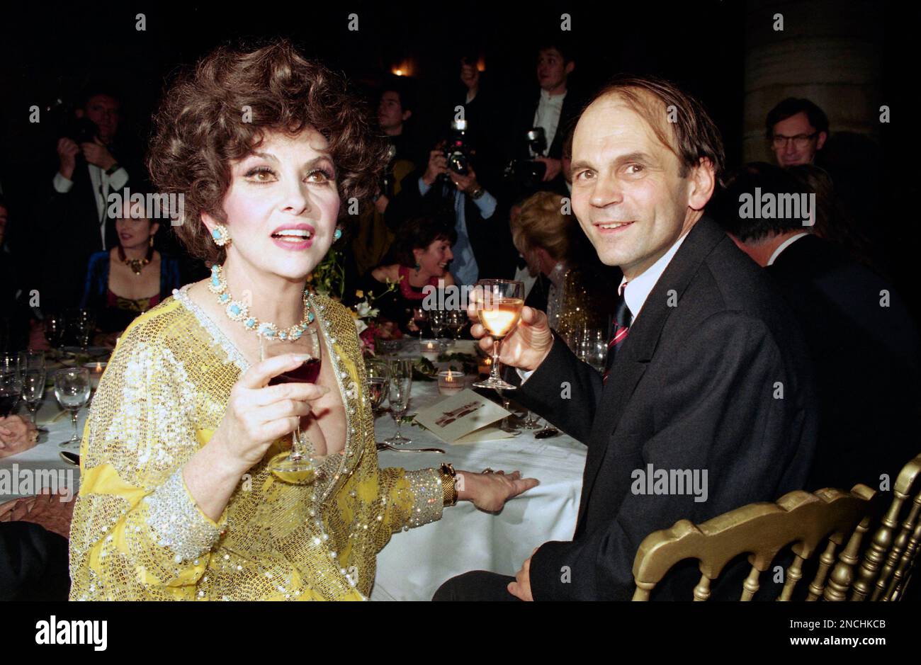 Italian Actress Gina Lollobrigida, left, prepares to clink glasses with ...