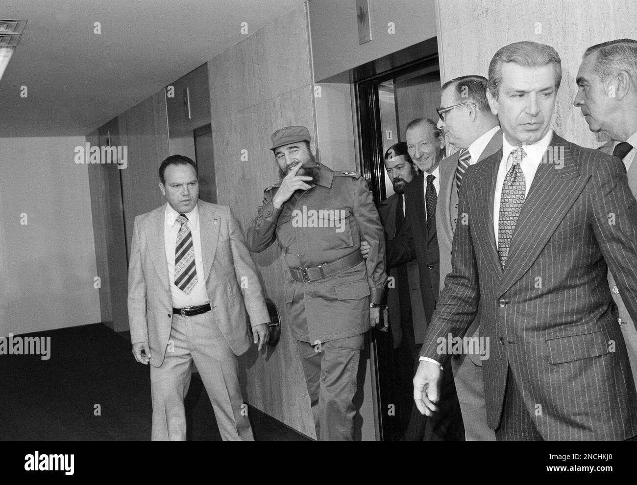 Cuban President Fidel Castro, dressed in his trade mark green fatigues ...