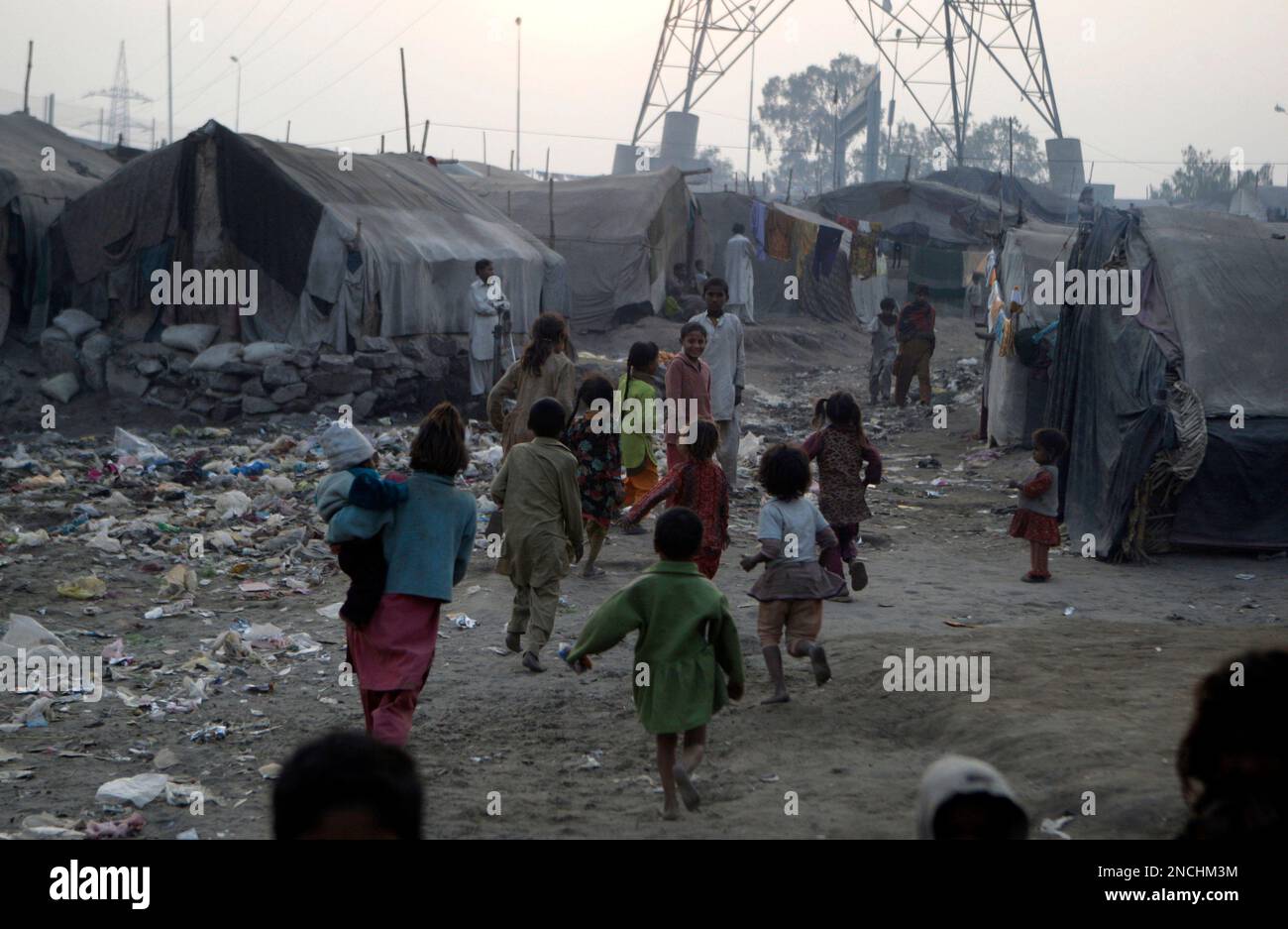 Pakistani children play in slums of Lahore, Pakistan on Friday, Dec. 10 ...