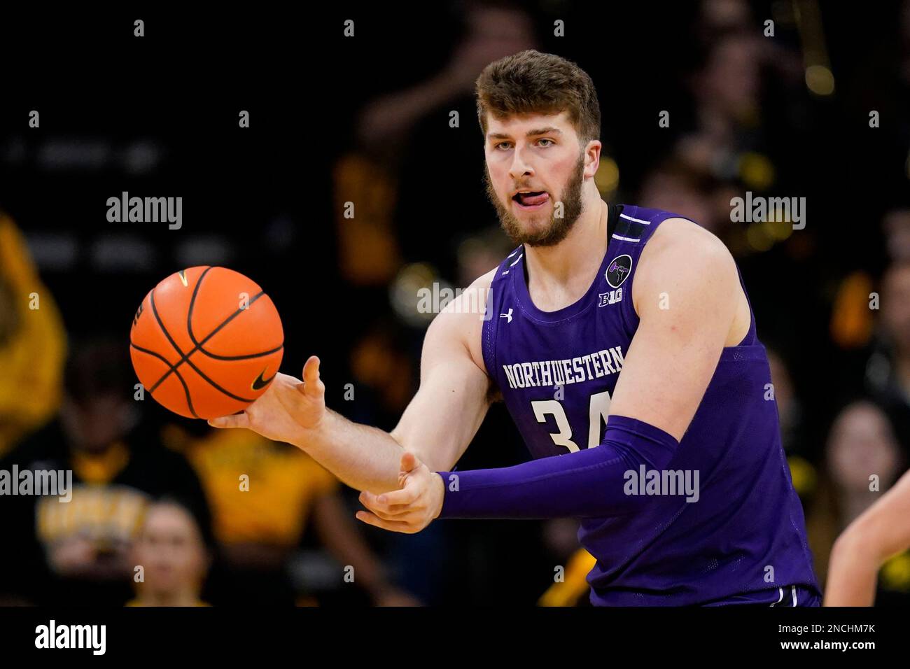 Northwestern center Matthew Nicholson passes to a teammate during the ...