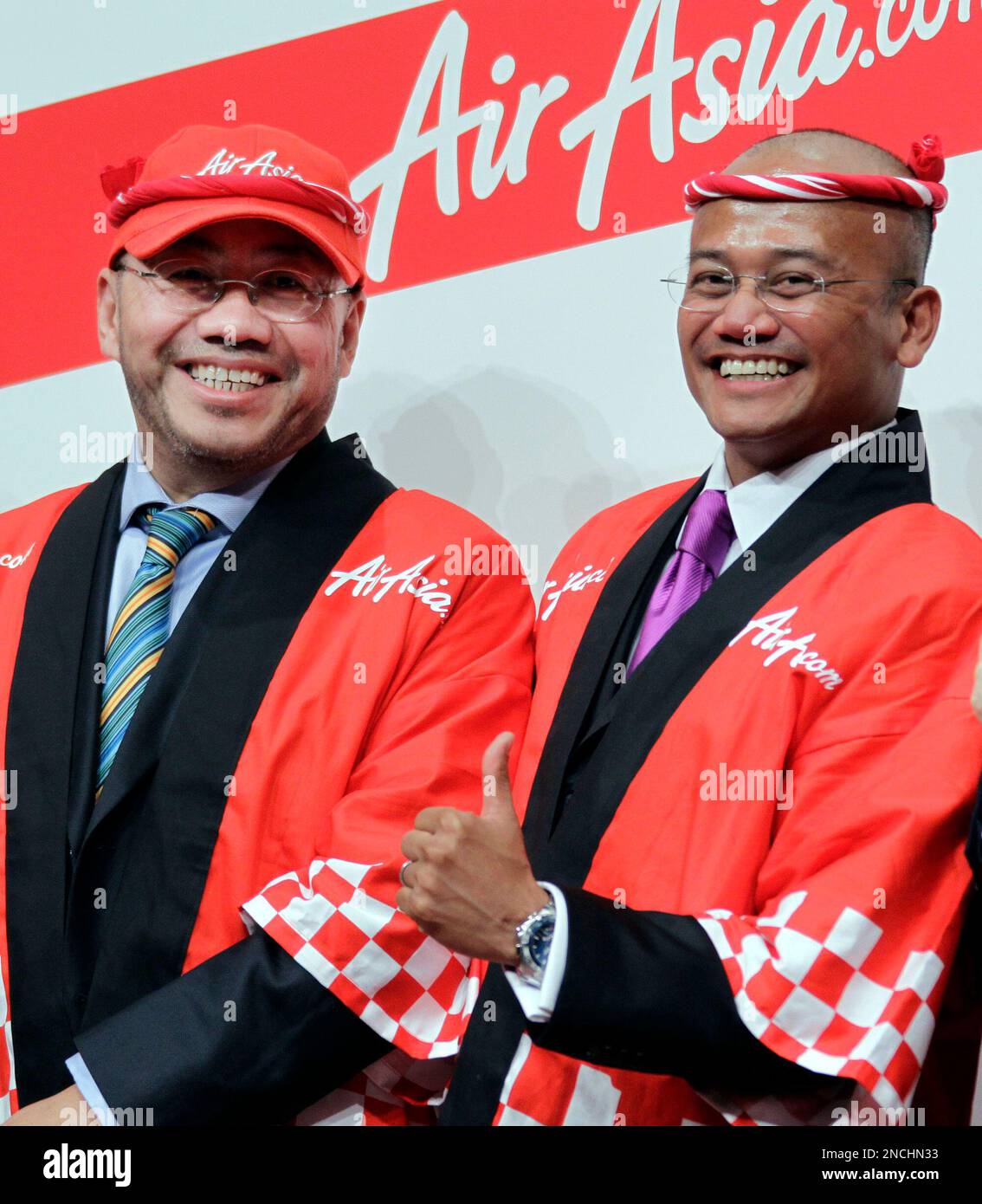 Azran Osman-Rani, chief executive officer of AirAsia X, right, and Dato ...