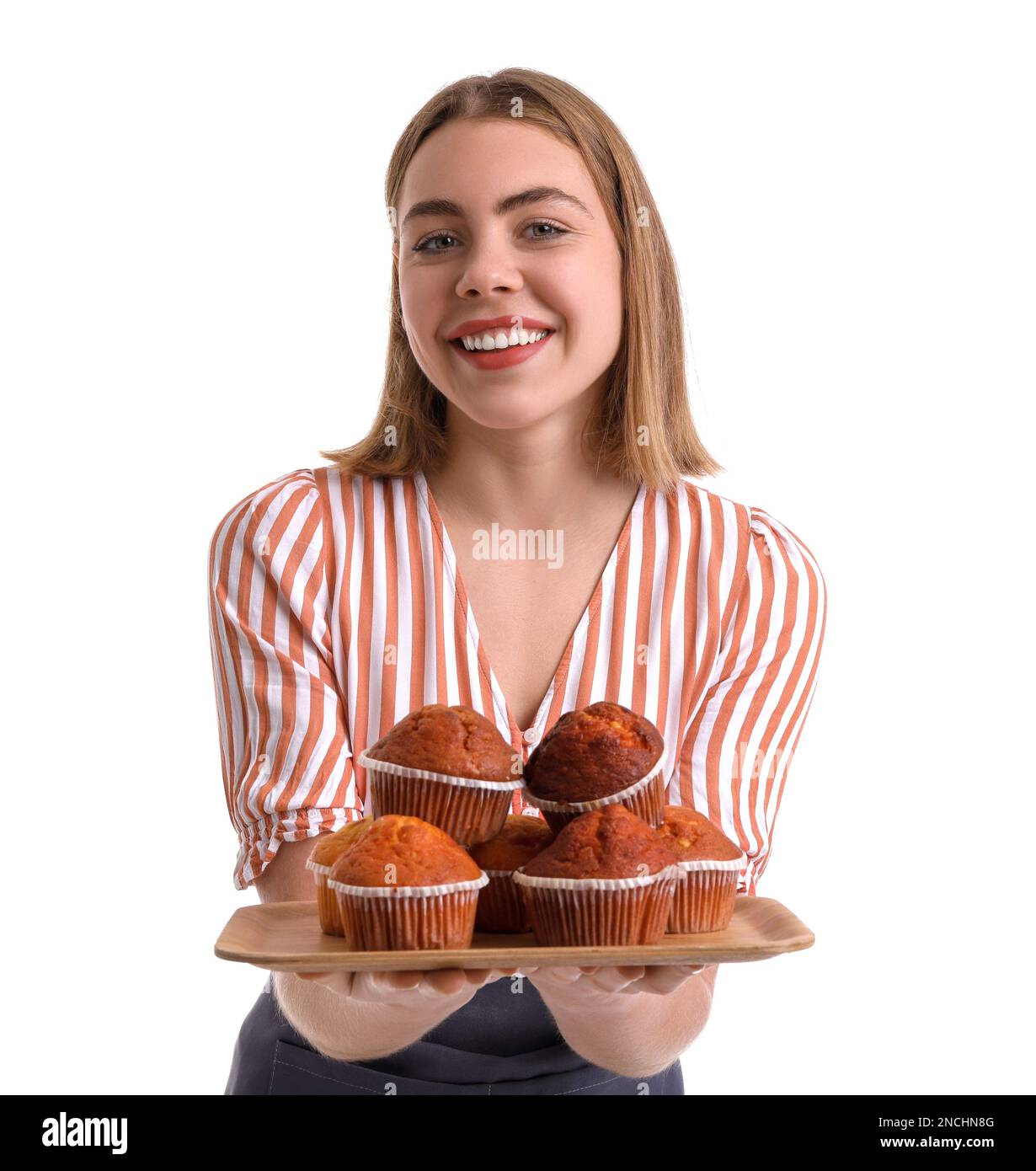 Female baker with tray of tasty cupcakes on white background Stock ...