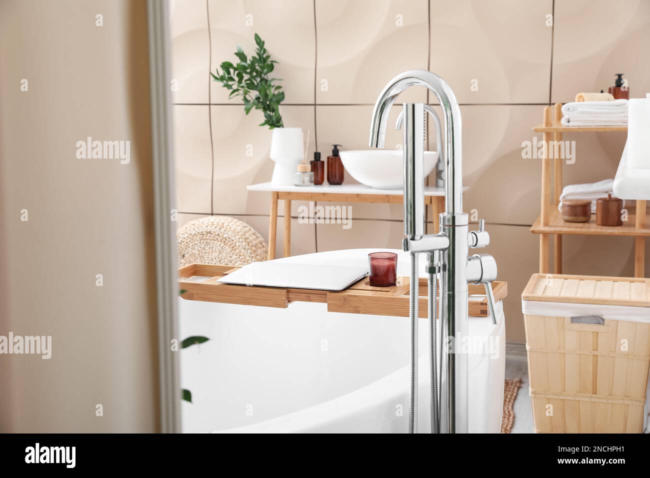 Interior of bathroom with modern bathtub and laptop on board Stock ...