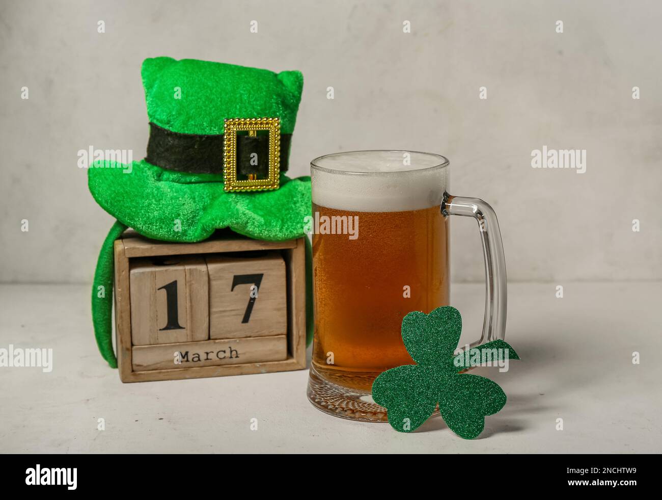 Glass of beer, calendar with date of St. Patrick's Day, Leprechaun hat ...