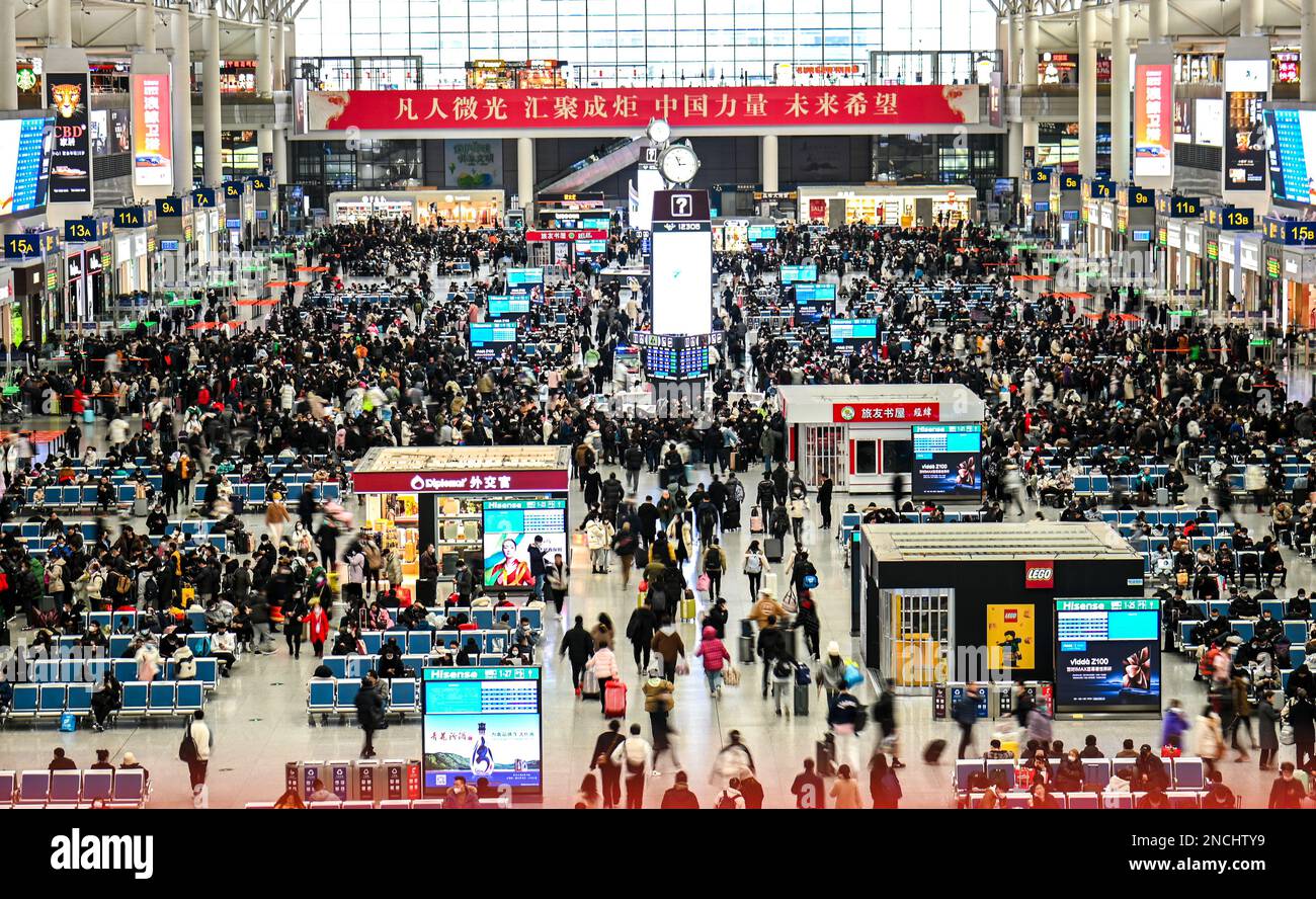 SHANGHAI, CHINA - FEBRUARY 14, 2023 - Passengers wait to board trains ...