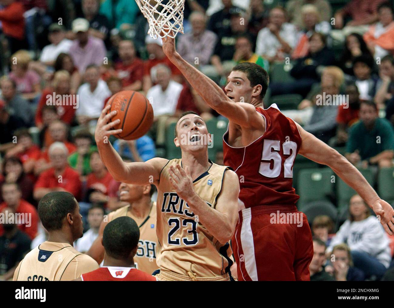 Notre Dame's Ben Hansbrough (23) goes in for a shot around Wisconsin's ...