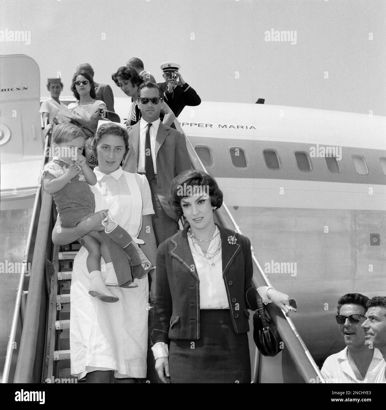 Italian movie star Gina Lollobrigida, followed by a German nurse ...