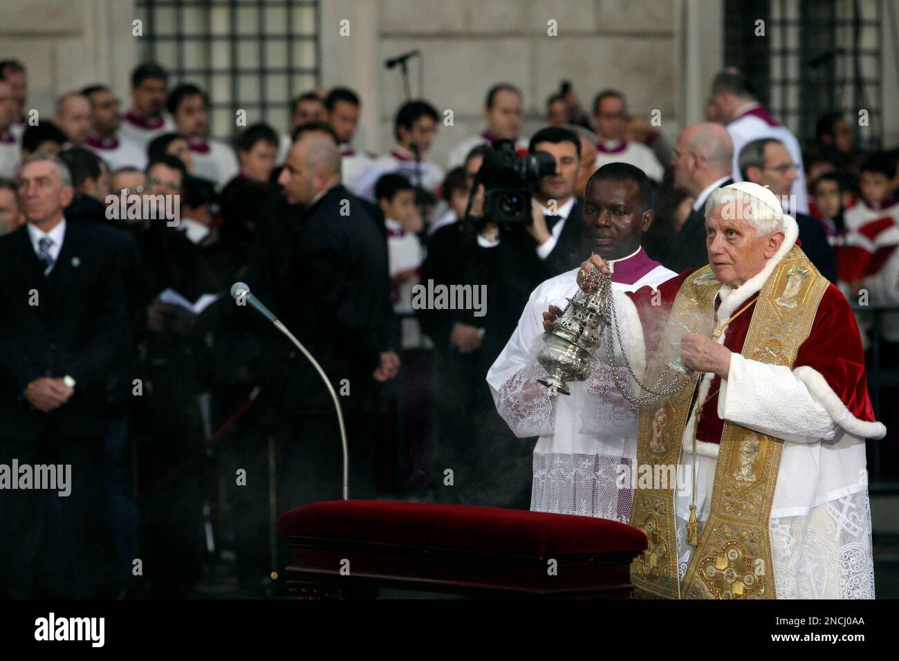 Pope Benedict XVI asperges incense in front of the statue of the Virgin ...