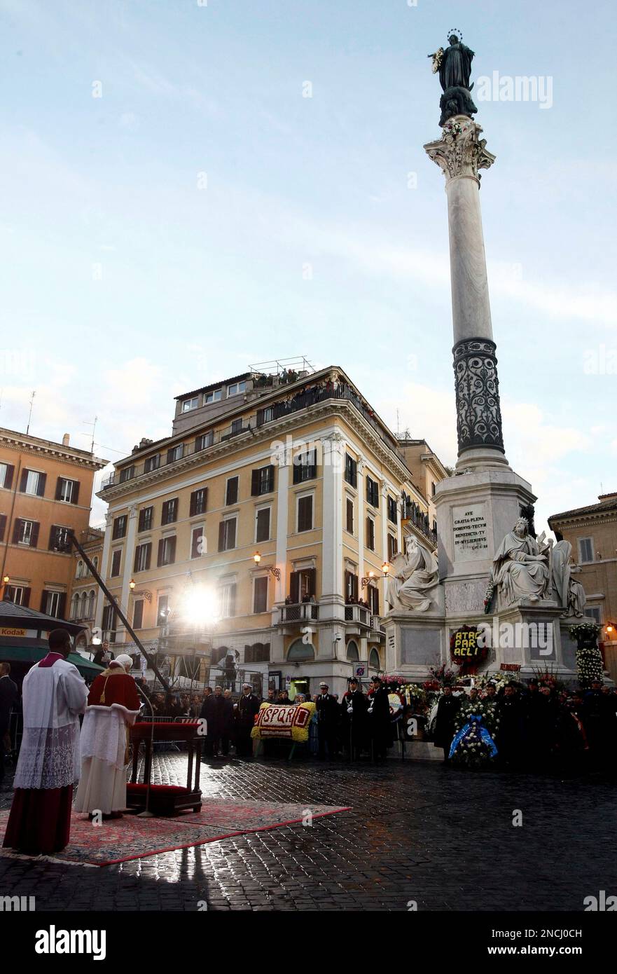Pope Benedict XVI prays in front of the statue of the Virgin Mary, on ...