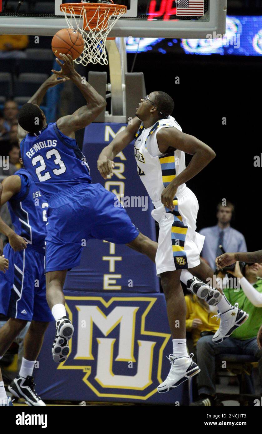 Texas A&M Corpus Christi's Justin Reynolds (23) is fouled as he goes up ...