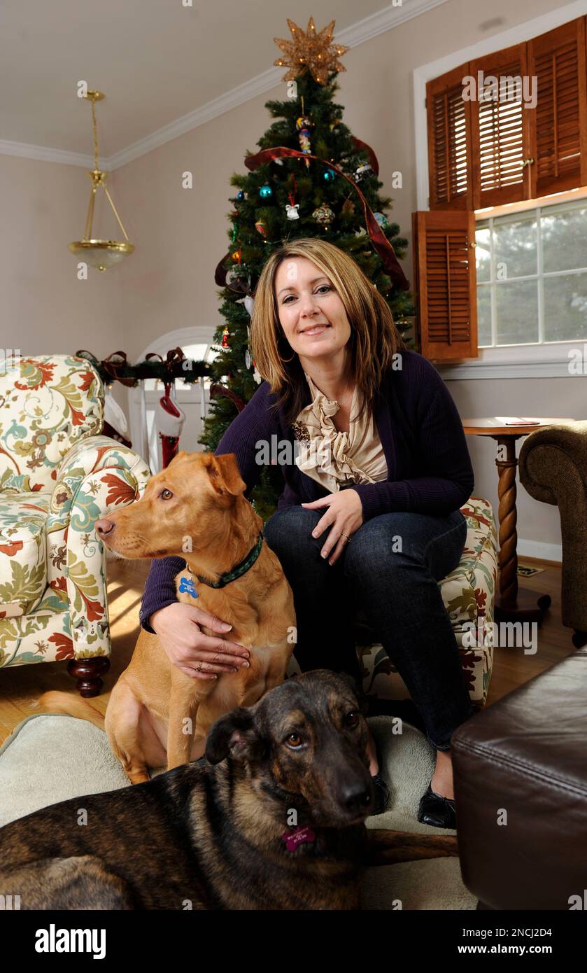 This Sunday, Dec. 5, 2010 photo shows Debbye Meszaros with her dogs ...