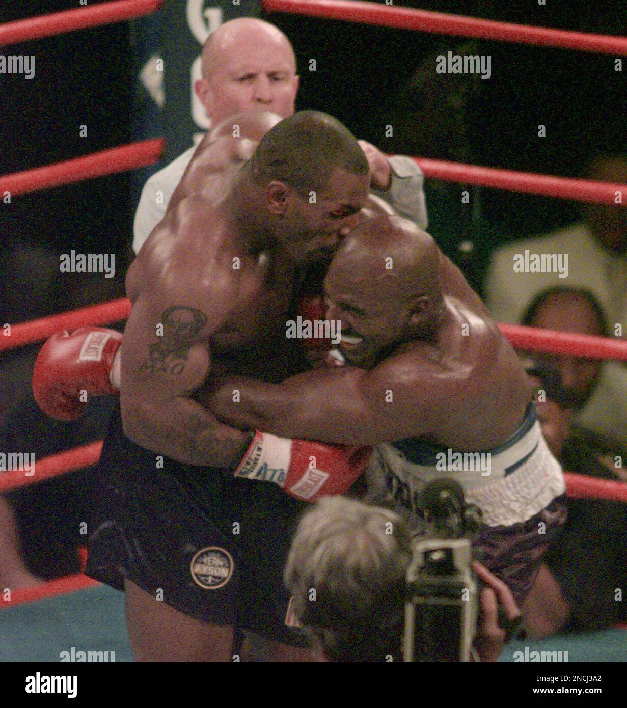 FILE - This June 28, 1997, file photo shows Mike Tyson biting into the ...