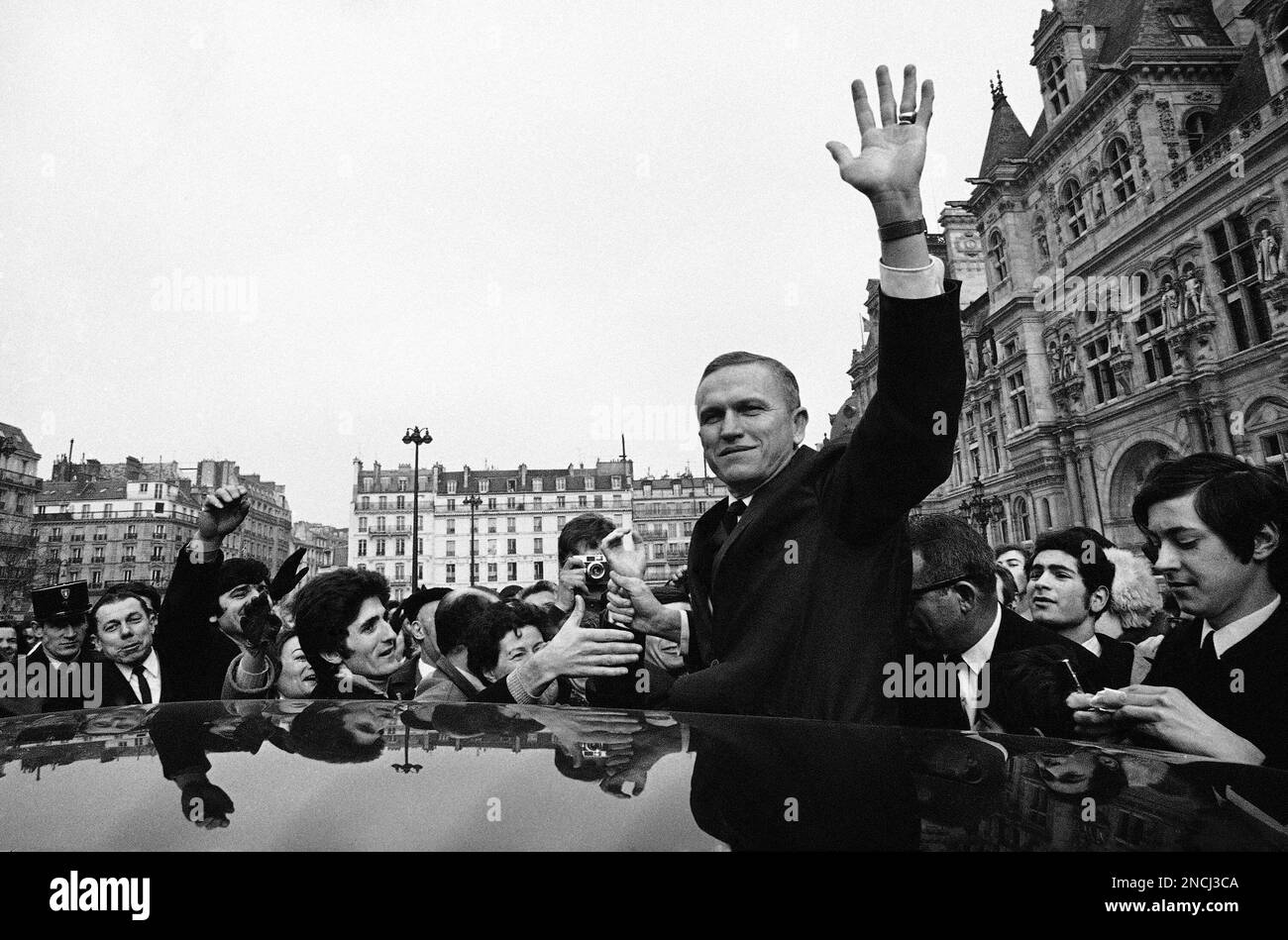 U.S. Colonel Frank Borman, commander of the Apollo 8 flight, waves a crowd outside the Paris ...