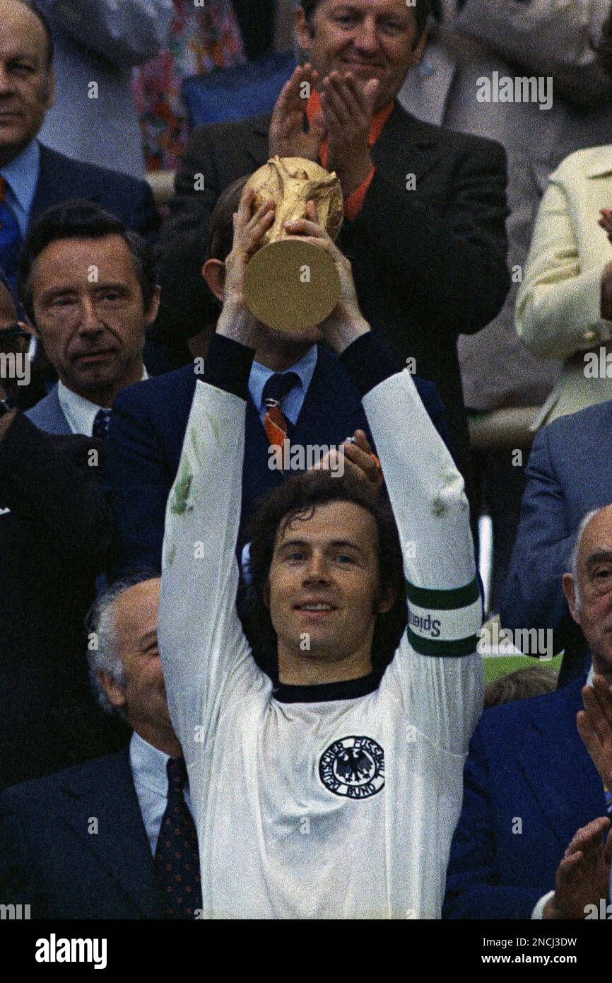 West Germany's national football team captain, Franz Beckenbauer, holds ...