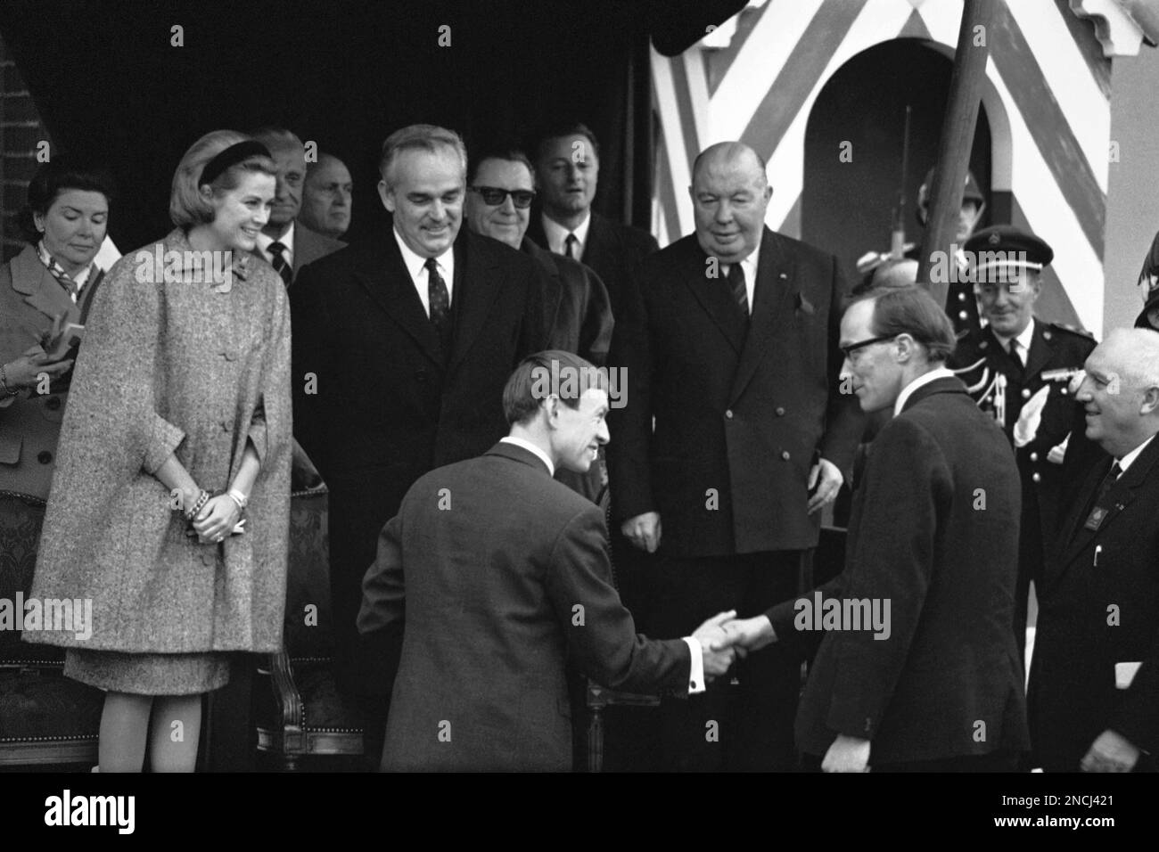 Ruano Aaltonen of Finland, right foreground, shakes hands with his ...