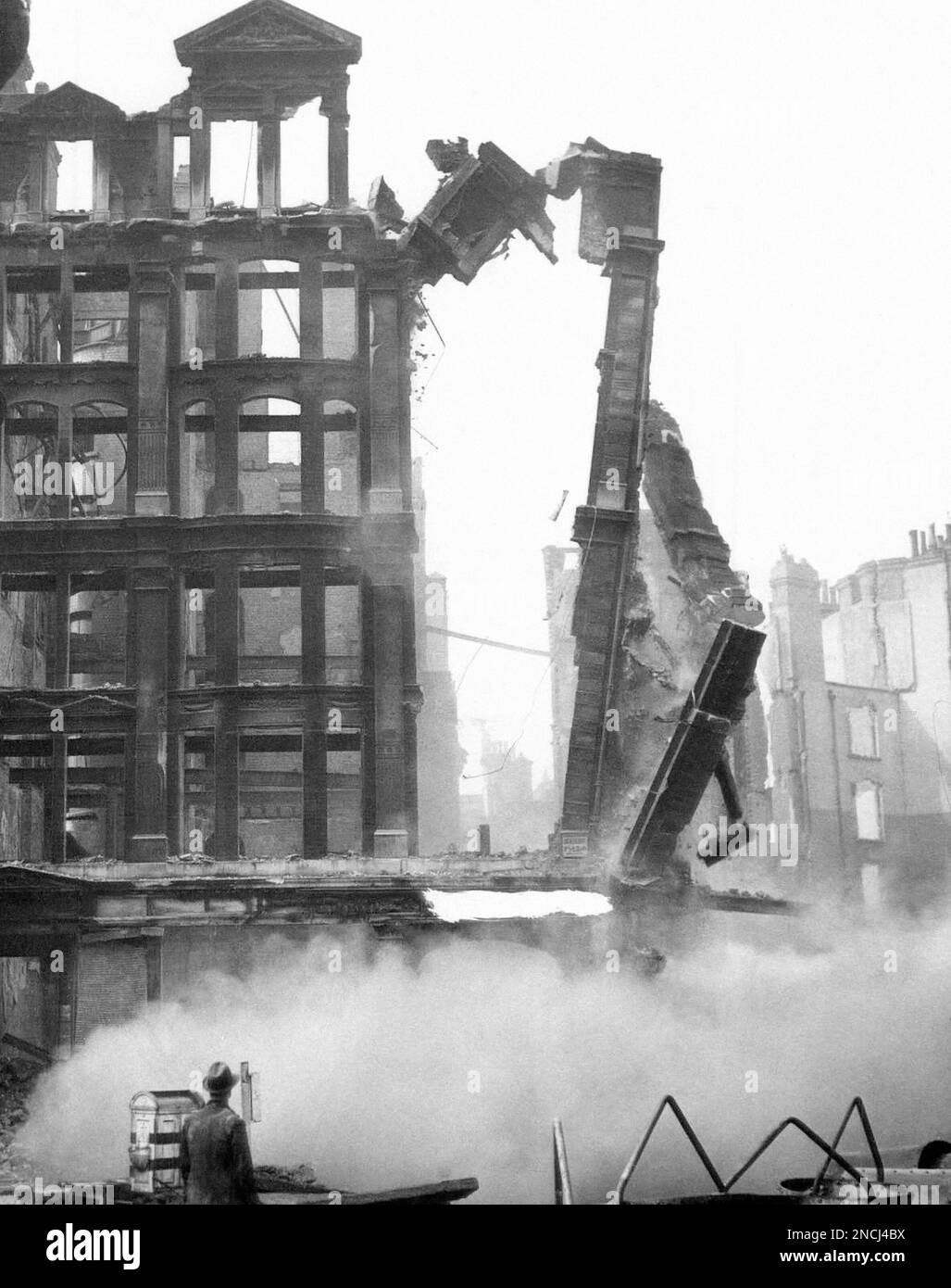 Parts of an unsafe building caught in mid-air by the camera, as the ...