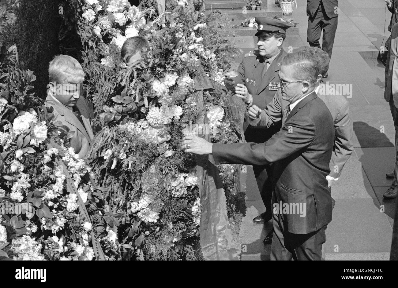 Frank Borman is putting the flowers to the Lenin tomb, right, and his ...