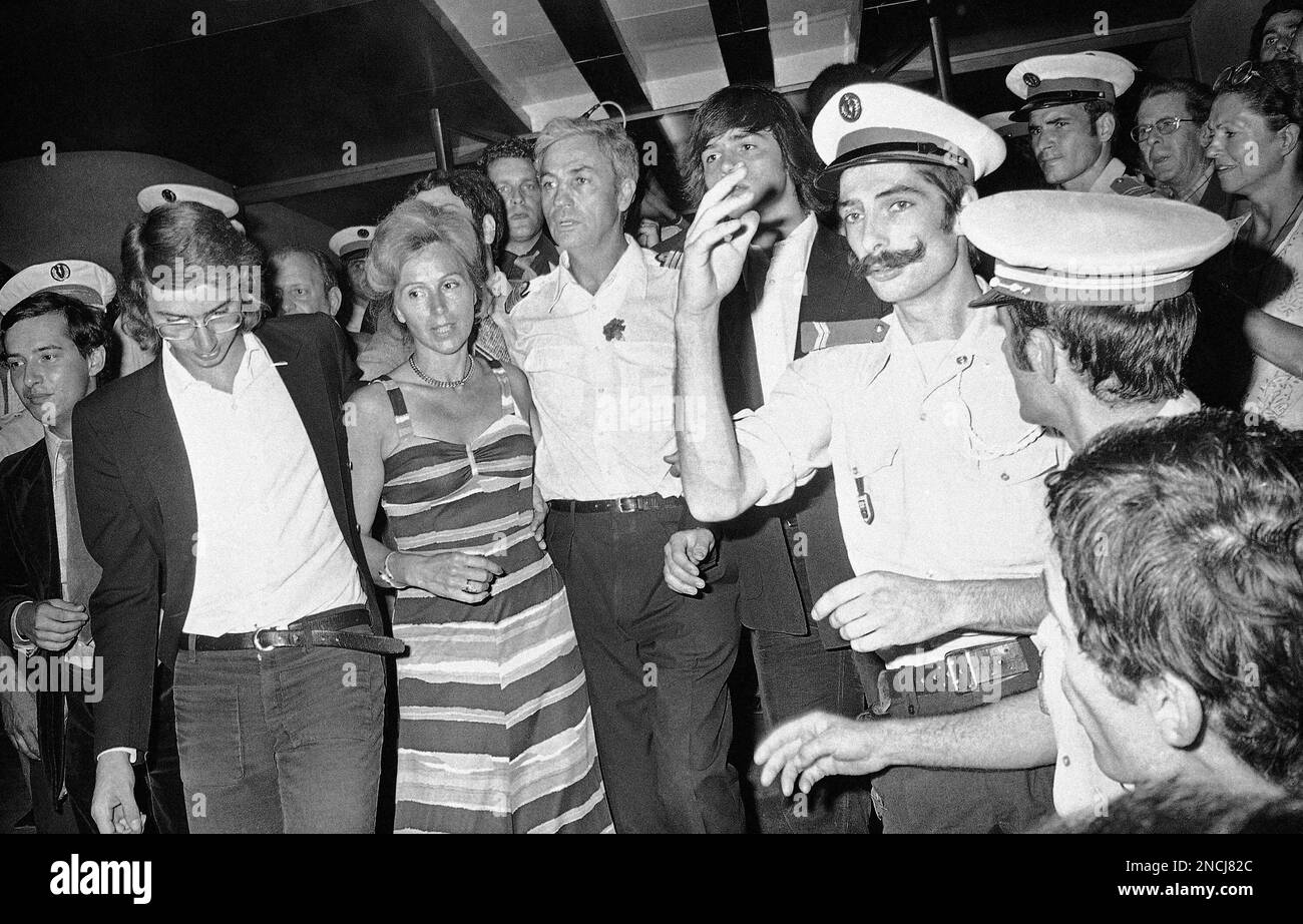 Head pilot Michel Bacos is reunited with his wife and son at Orly ...