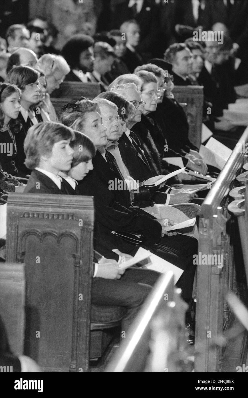 President Jimmy Carter and first lady Rosalynn Carter sit between ...