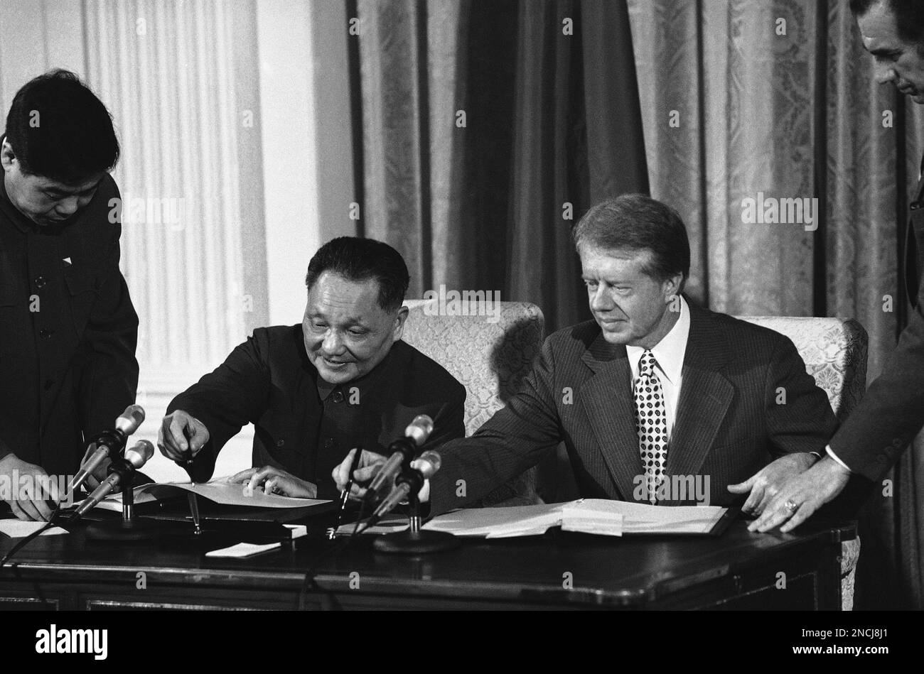 President Jimmy Carter, and Chinese Vice Premier Teng Hsiao-ping sign ...