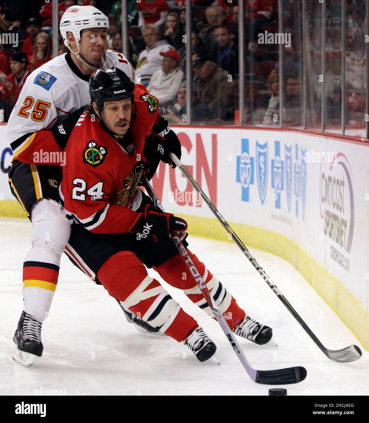 Chicago Blackhawks' Nick Boynton(24) controls the puck against Calgary ...