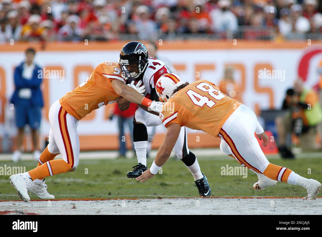 Tampa Bay Buccaneers linebacker Niko Koutouvides (53) and Andrew ...