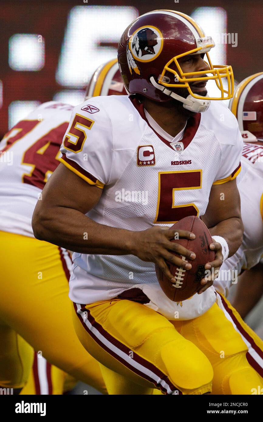Washington Redskins quarterback Donovan McNabb (5) drops bak for a pass ...