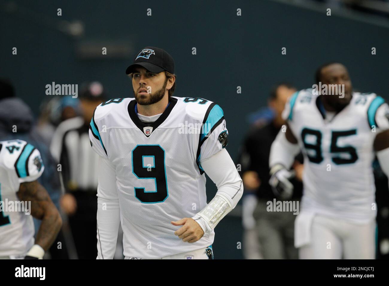 Carolina Panthers Keith Null (9) runs onto the field before their NFL ...