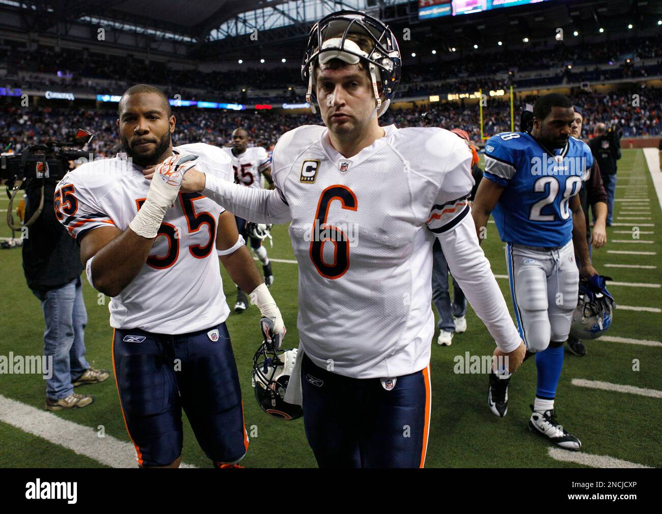 Chicago Bears linebacker Lance Briggs (55) and quarterback Jay Cutler (6) walk off the field ...