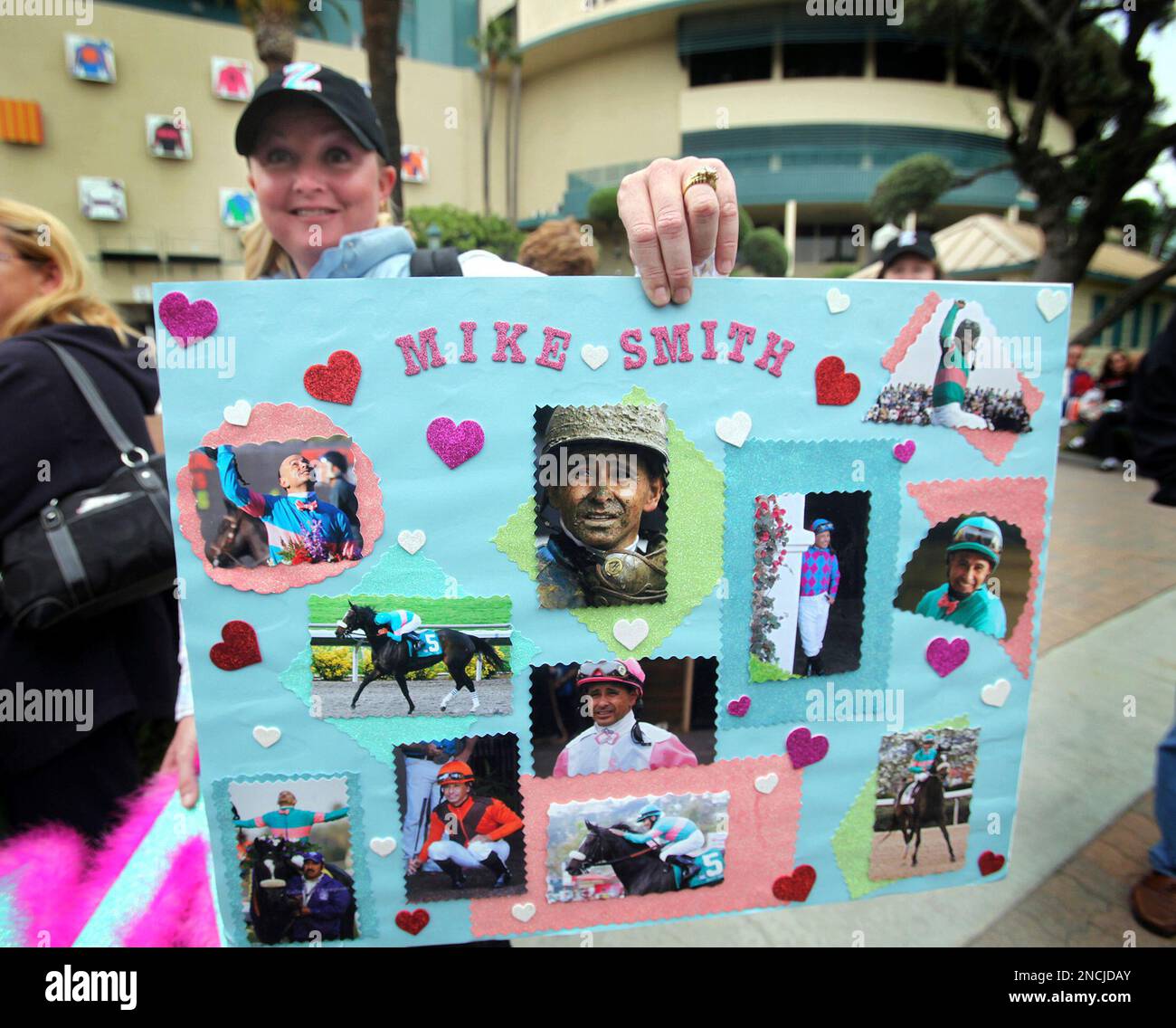 Sarah Bergstrom, of Riverside, shows off her hand-made poster honoring ...