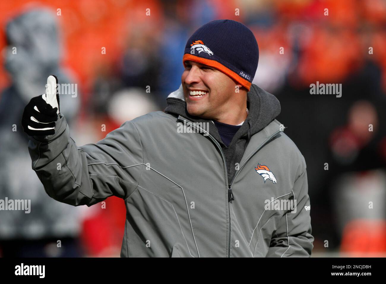 Denver Broncos head coach Josh McDaniels gives his team a thumbs up ...