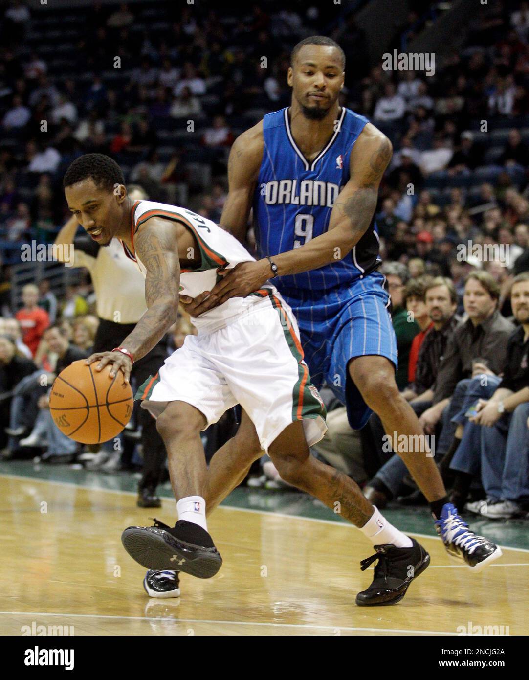 Orlando Magic's Rashard Lewis (9) fouls Milwaukee Bucks' Brandon ...