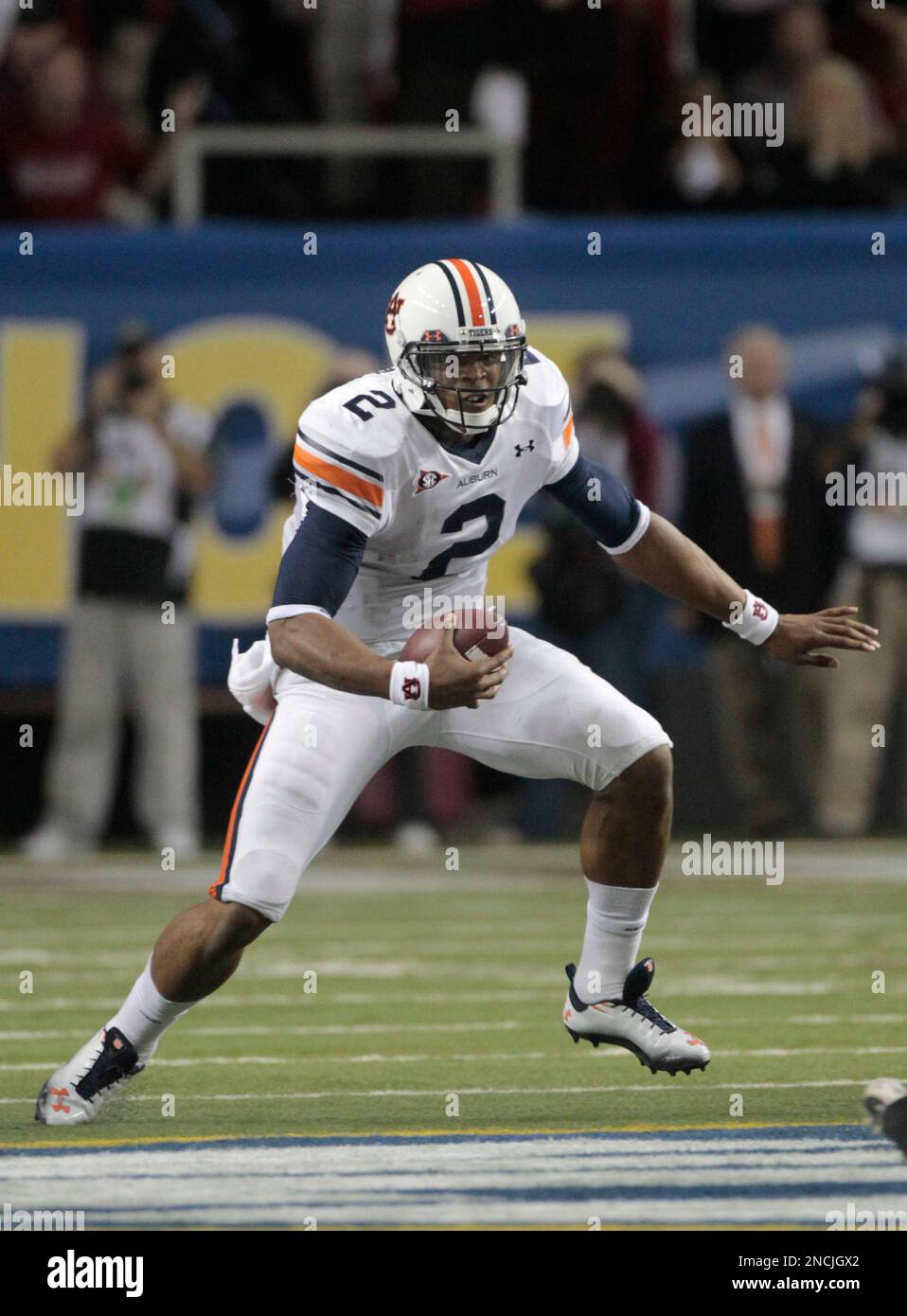 Auburn quarterback Cameron Newton (2) looks for running room in the ...