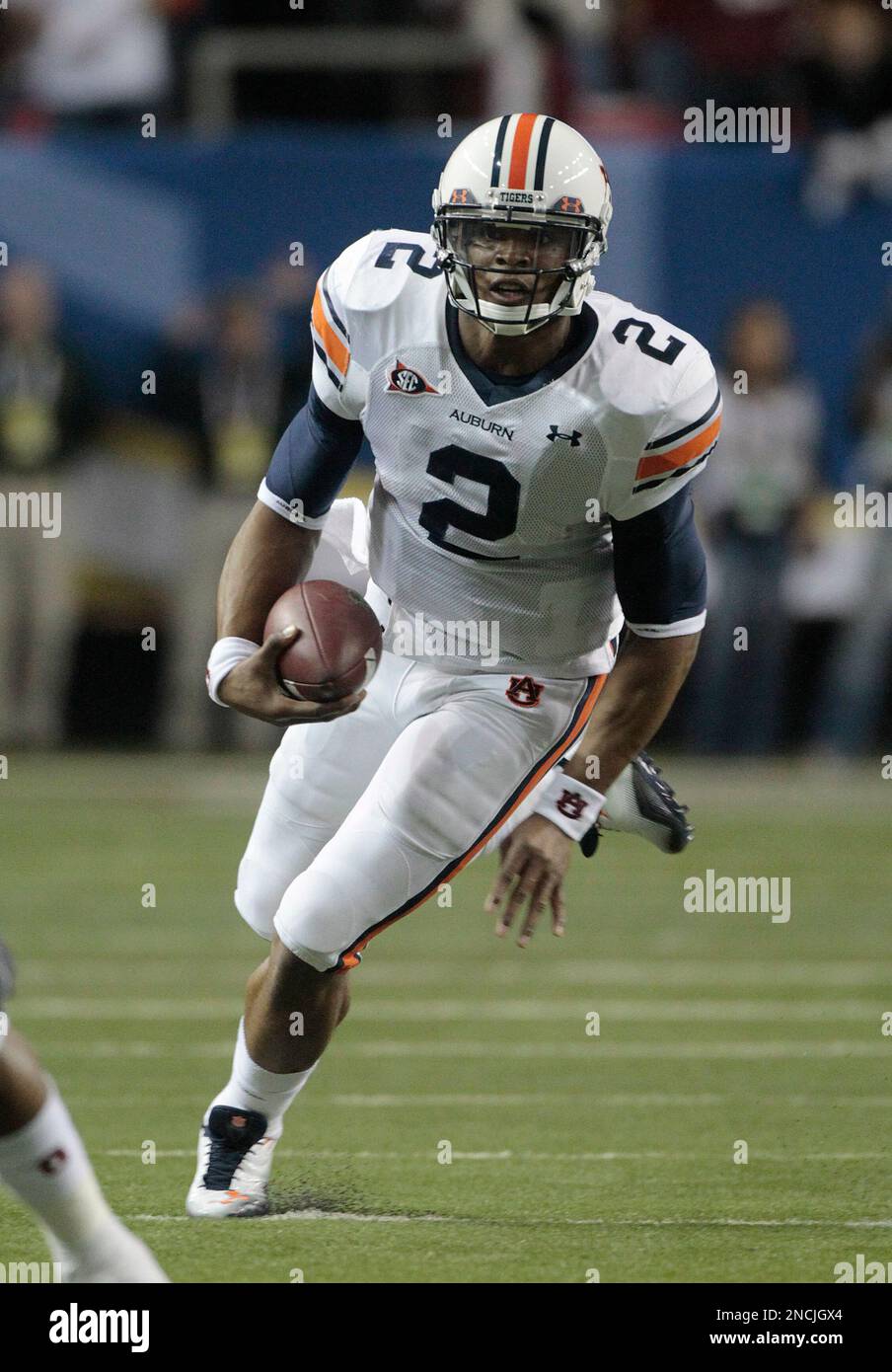 Auburn quarterback Cameron Newton (2) looks for running room in the ...