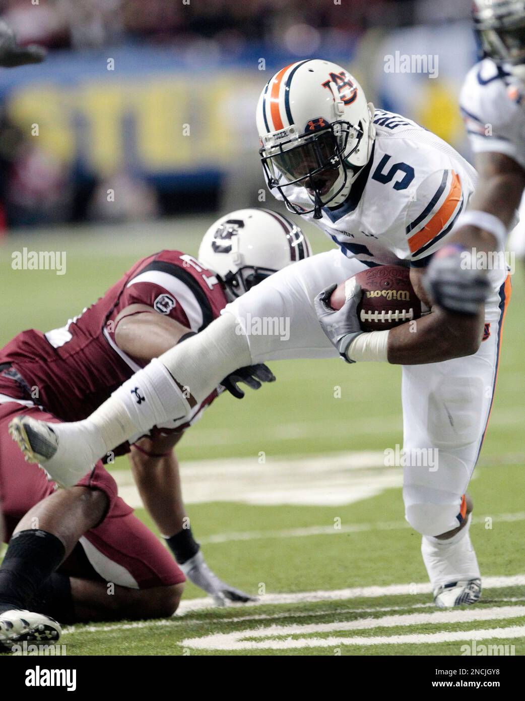Auburn running back Michael Dyer (5) bounces out of the tackle of South ...