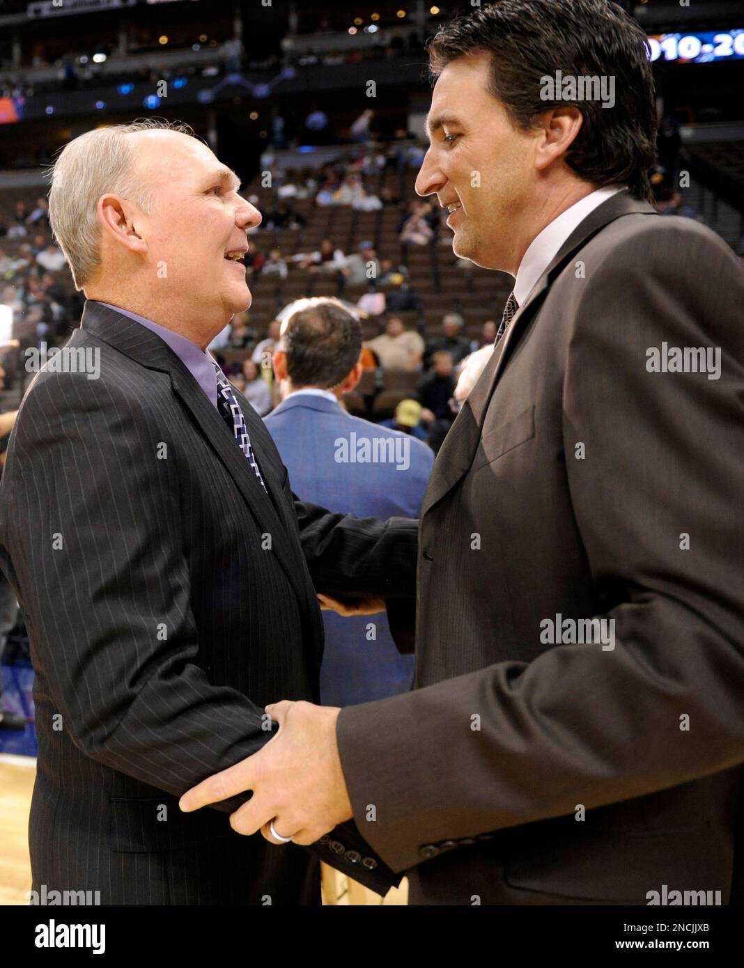 Denver Nuggets head coach George Karl, left, talks with Los Angeles ...
