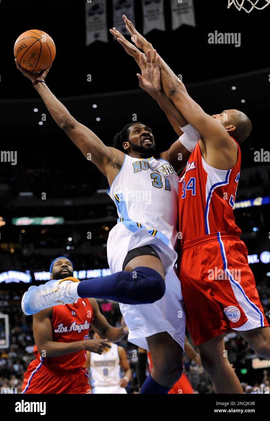 Denver Nuggets center Nene (31) from Brazil goes up for a shot against ...