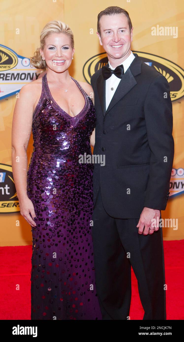 Kurt Busch, right, and wife Eva arrive at the NASCAR Sprint Cup Series ...