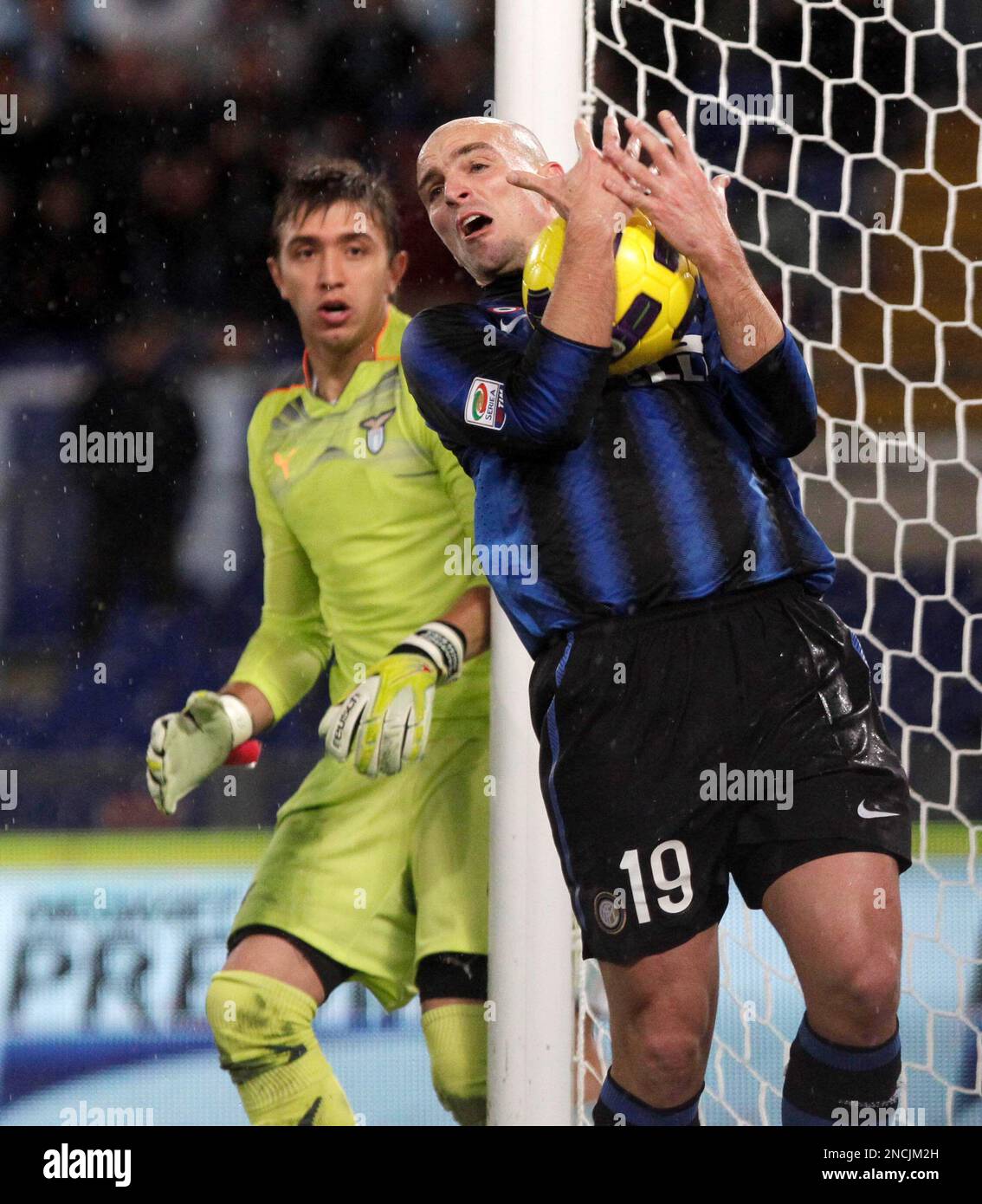 Inter Milan's Esteban Cambiasso, of Argentina, right, grabs the ball as ...