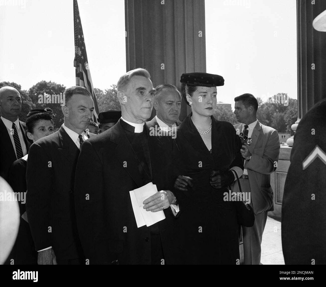 The Rev. Dr. Frederick Brown Harris, chaplain of the Senate, escorts ...