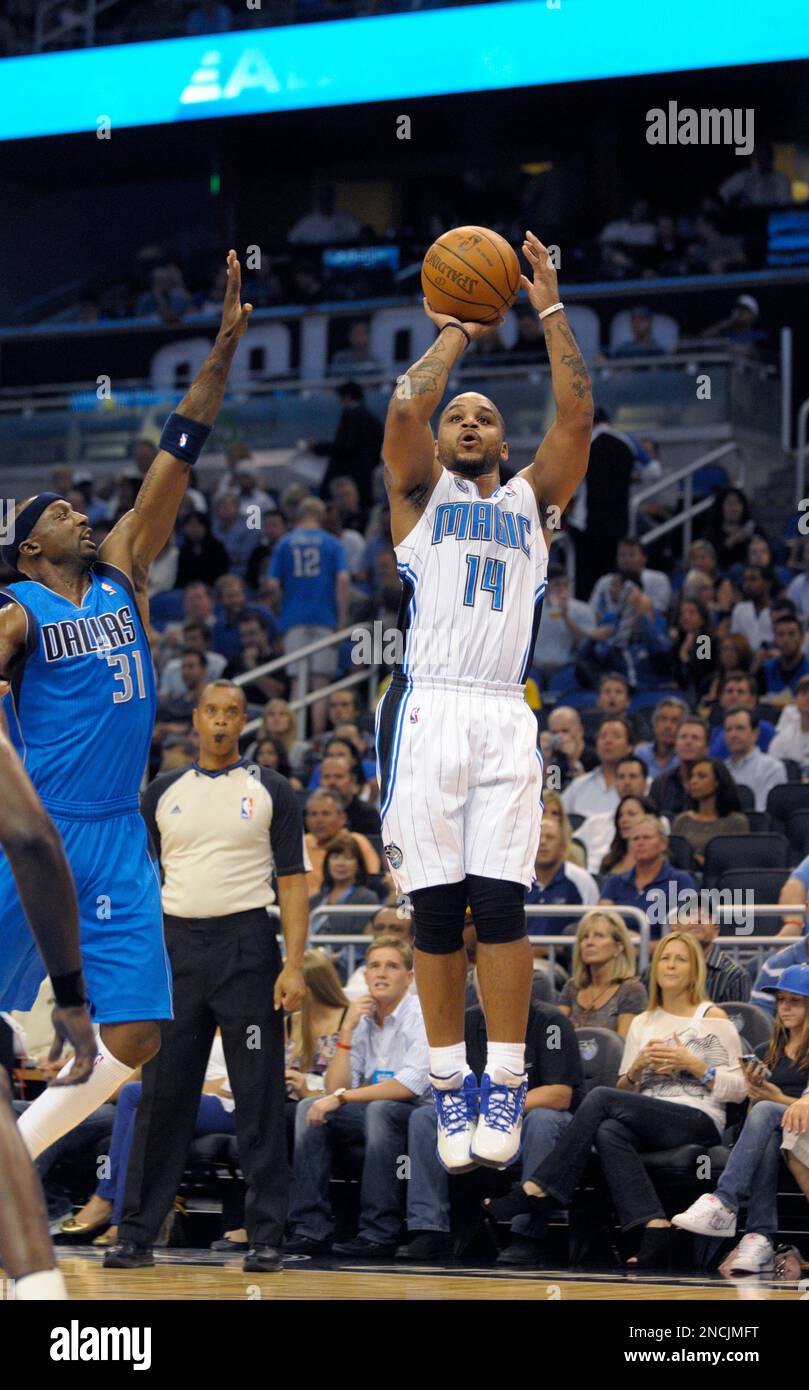 Orlando Magic guard Jameer Nelson, right, puts up a shot in front of ...