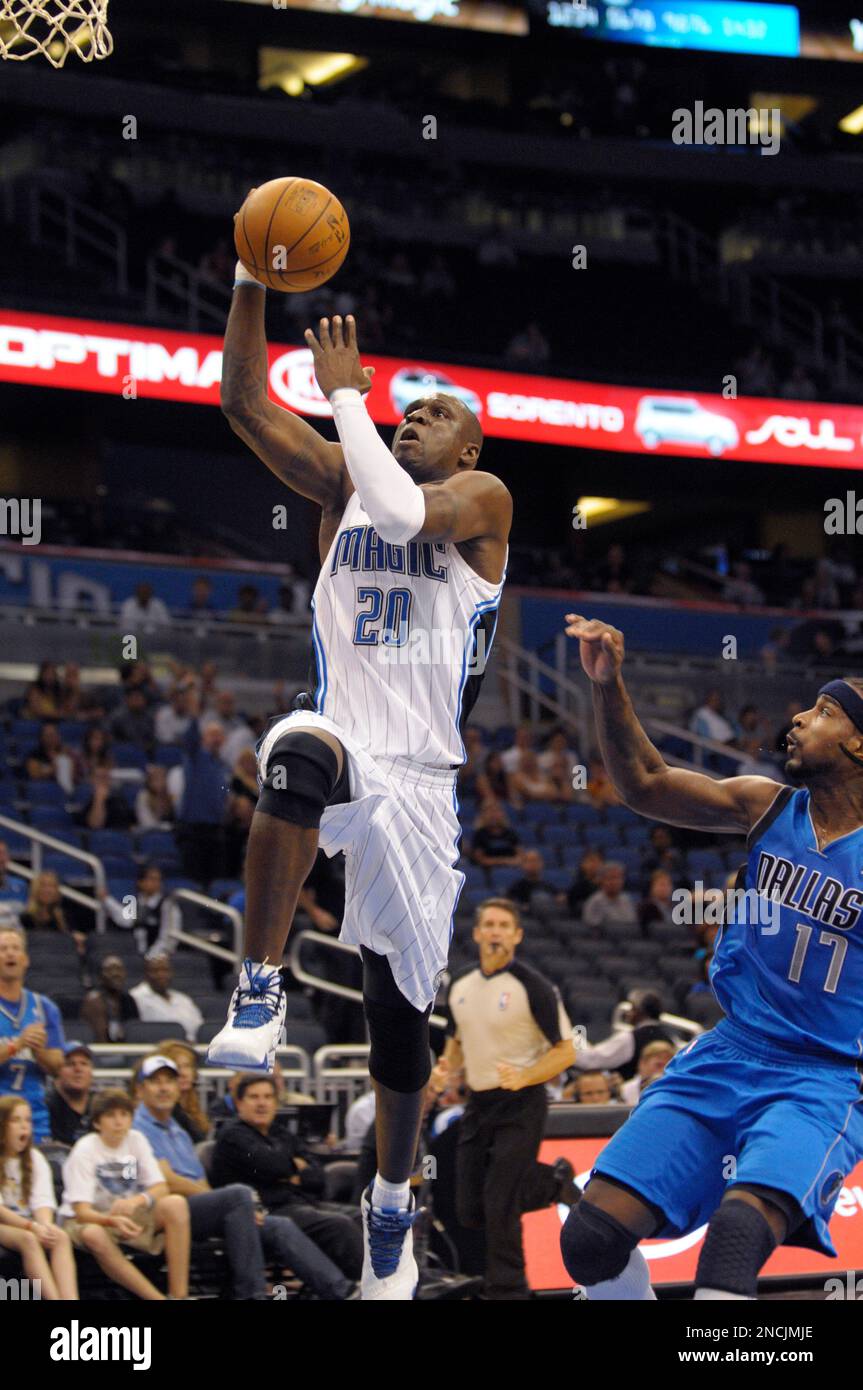 Orlando Magic forward Mickael Pietrus, left, of France, goes up for a ...