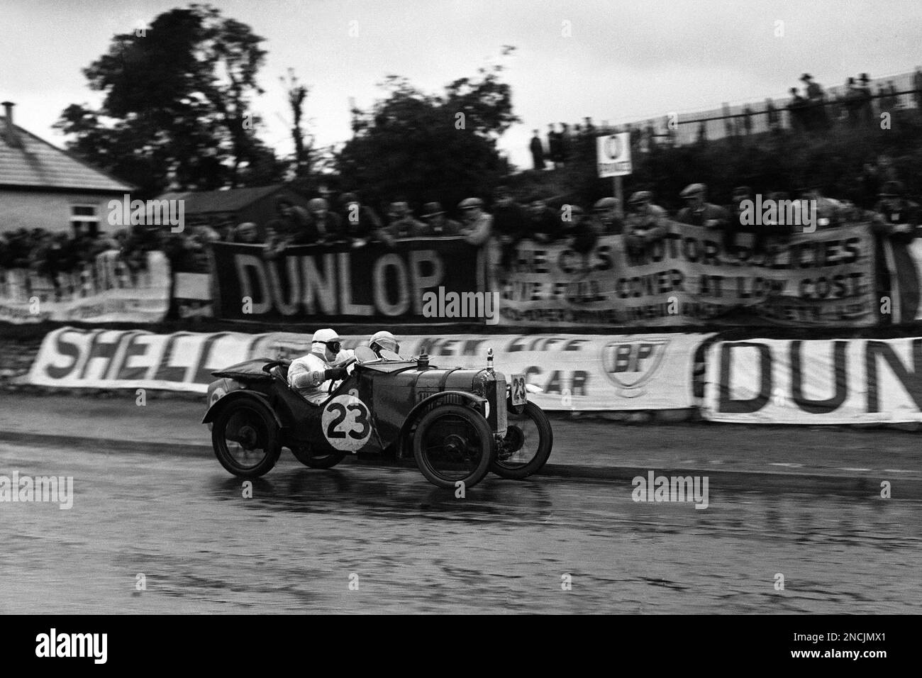 Tazio Nuvolari, the winner, speeding in his Alfa Romeo on the last lap ...