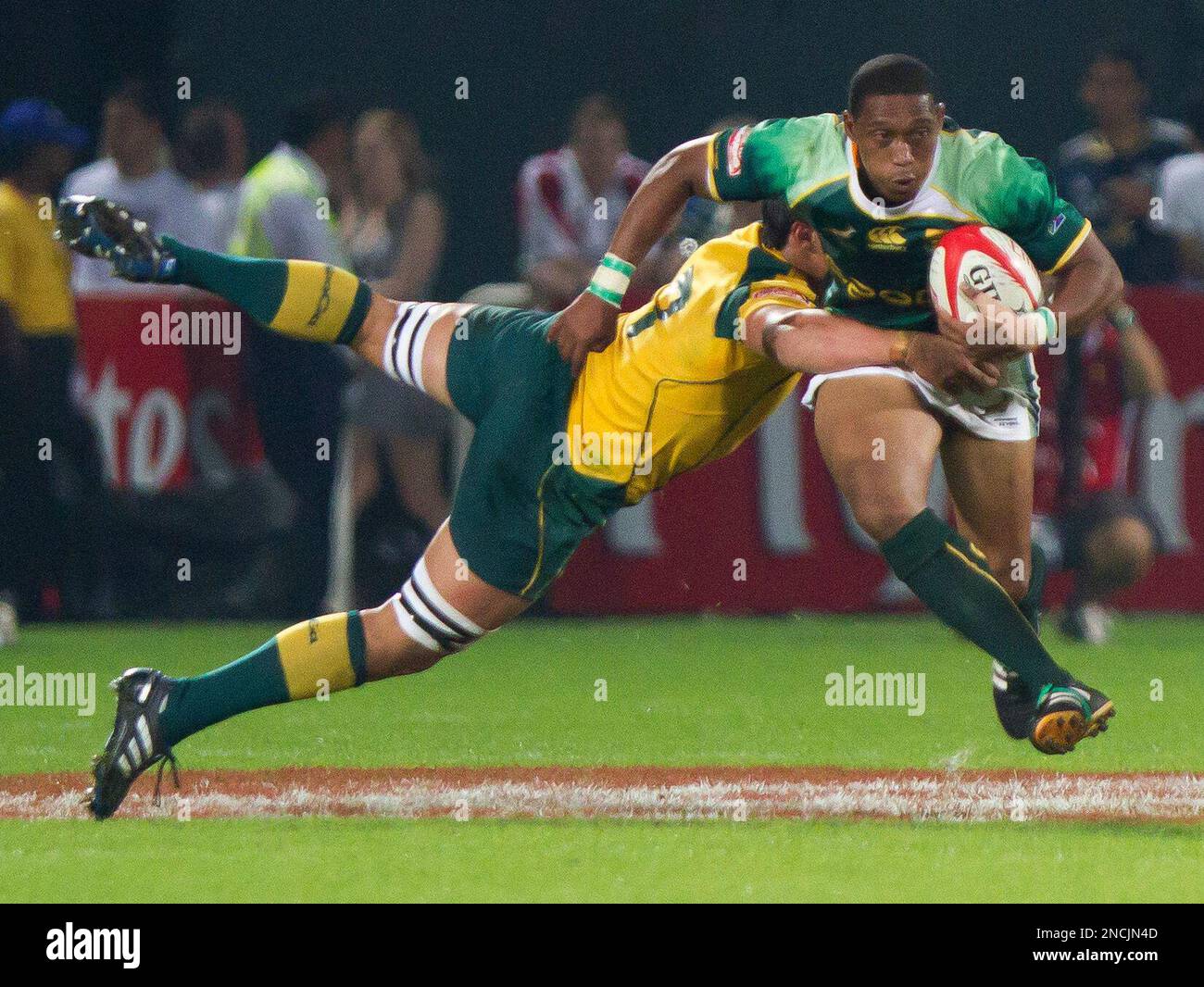 Australia's , Nick Phipps, left, tackles South Africa's, Renfred Dazel ...