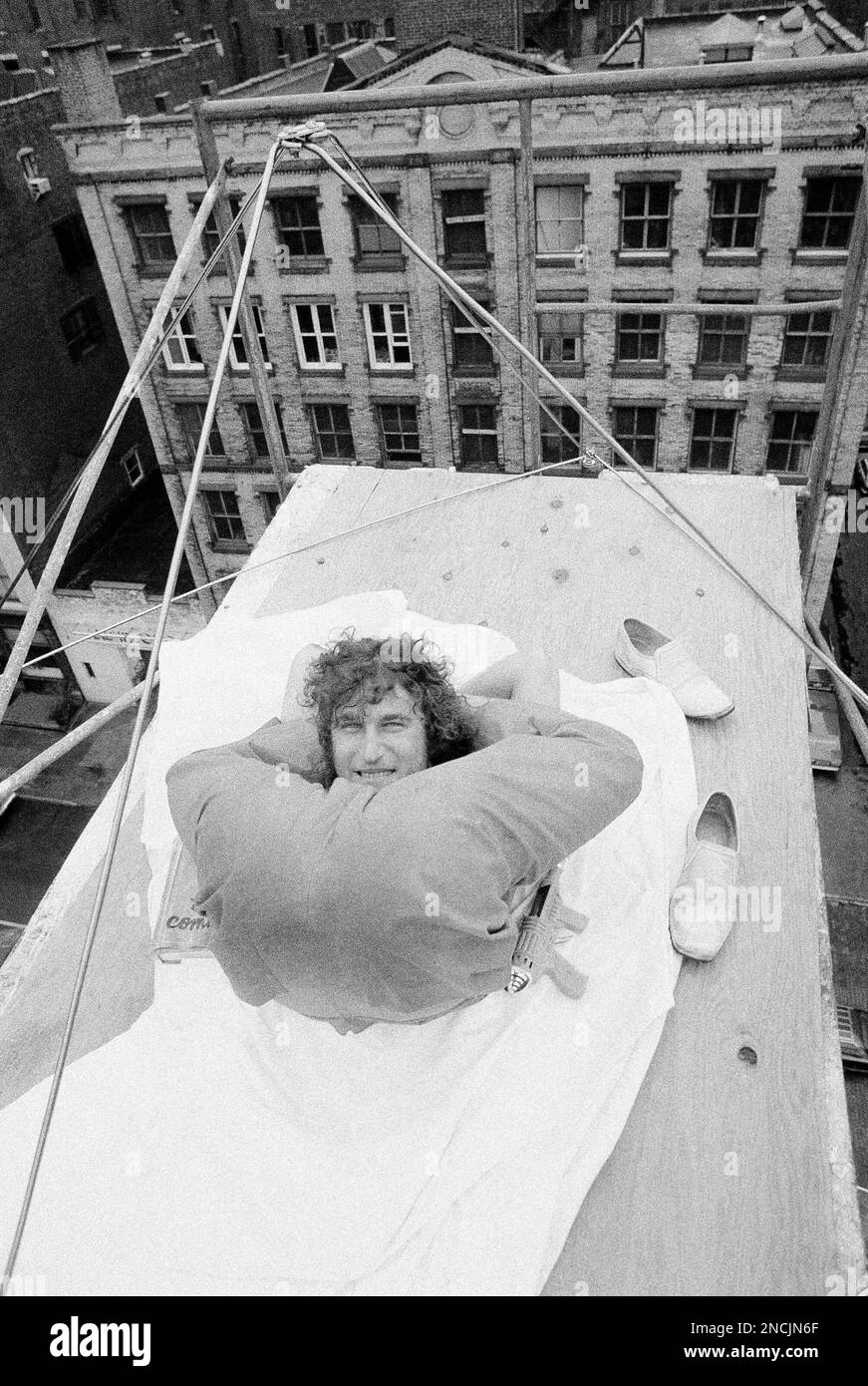 Tom Kay, 23, of Great Neck, Long Island, does yoga on a pyramid-shaped ...