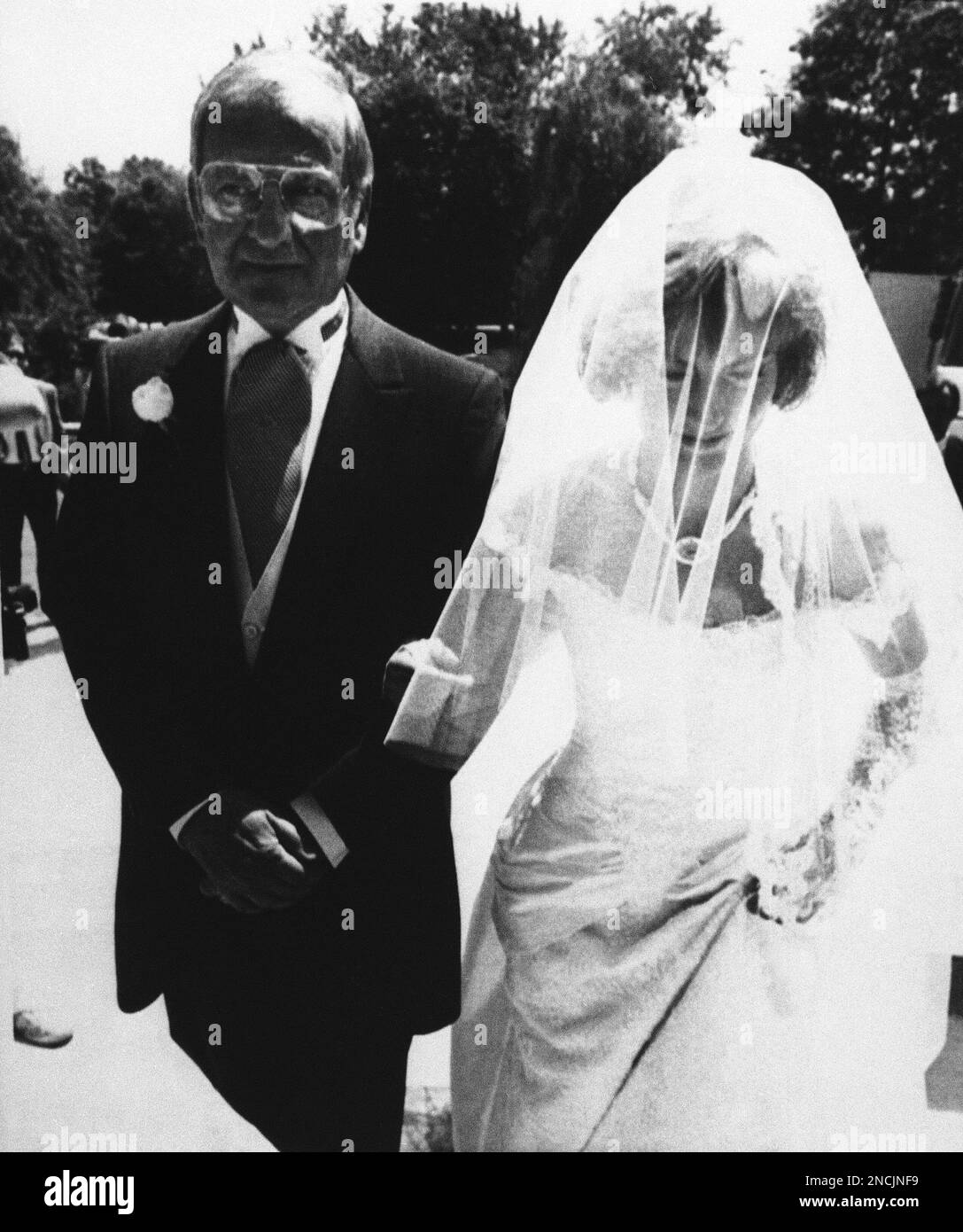Chrysler Corp. Chairman Lee Iacocca escorts his daughter, Kathi, into ...